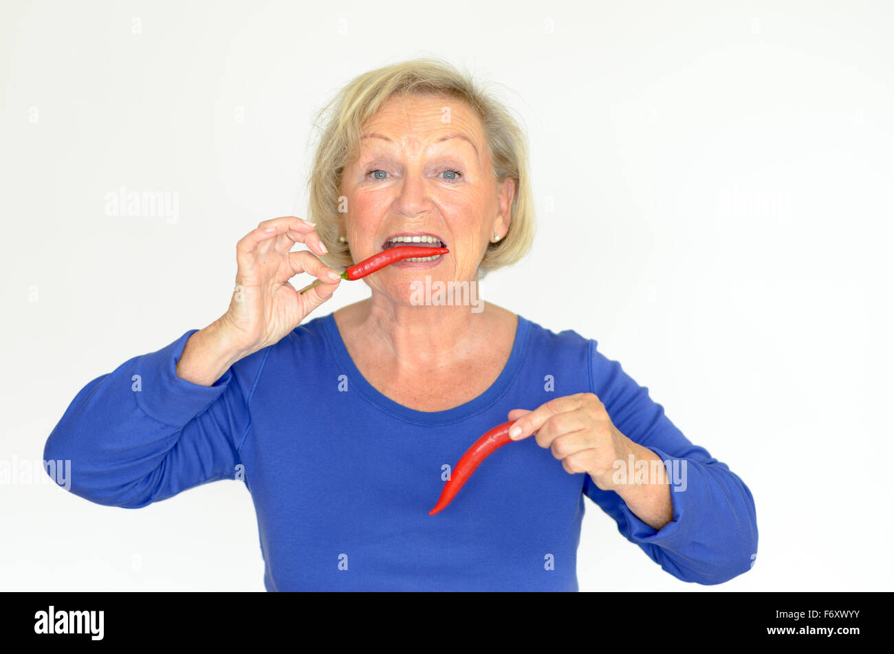 Biting a chili hi-res stock photography and images - Alamy