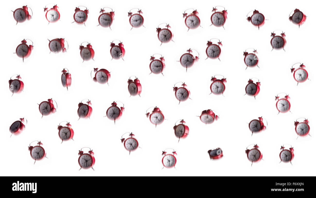 clocks falling from the air on white background cut out Stock Photo - Alamy