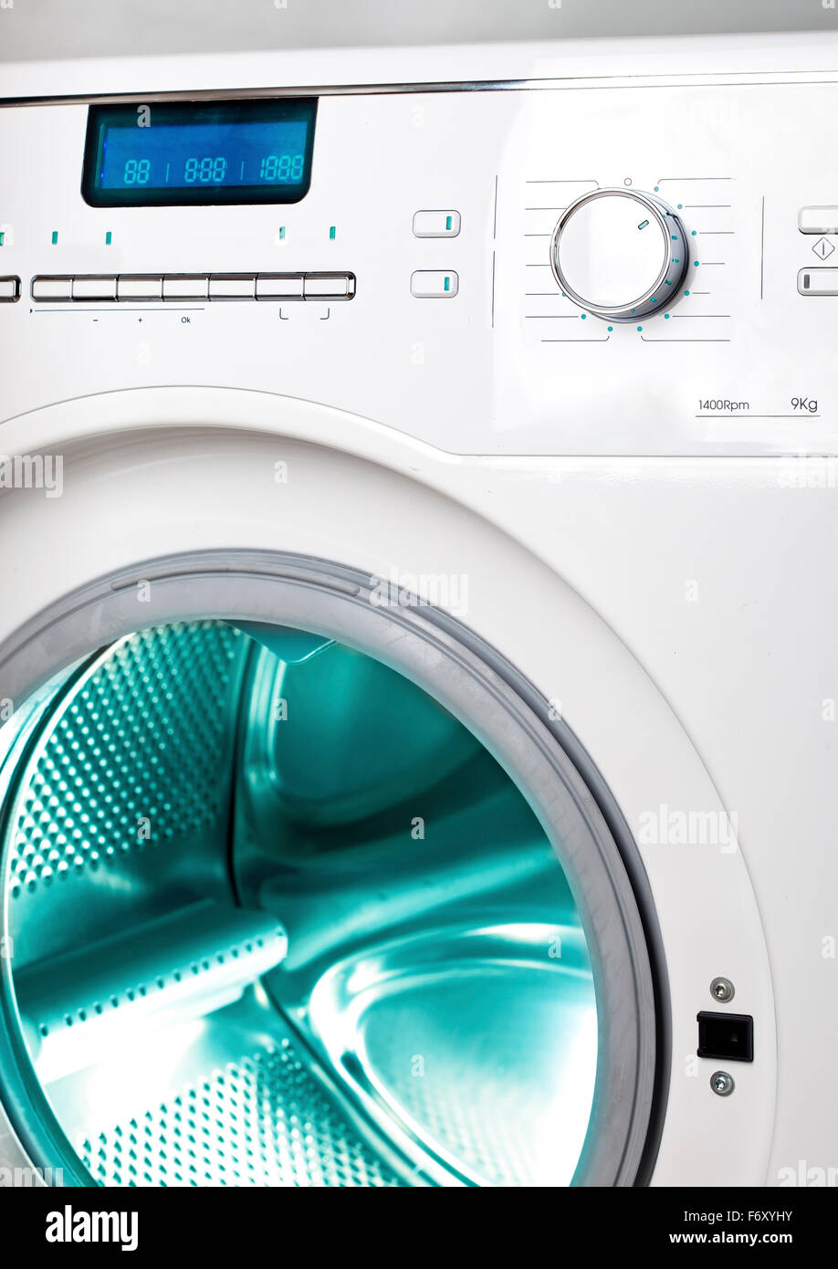 The washing machine - a close up of the display, the manhole and a ...