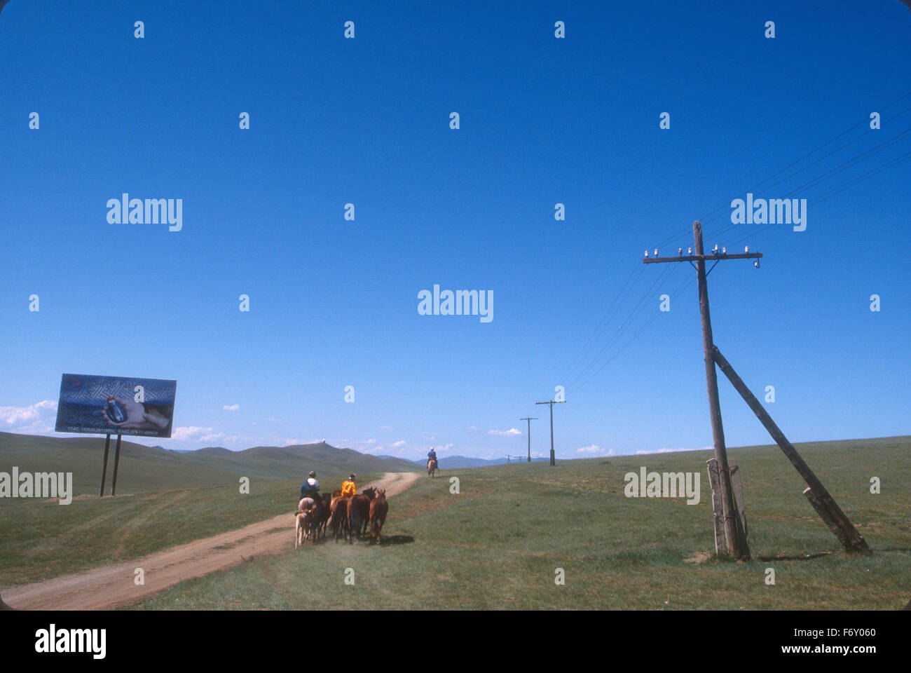 Mongolian man on a horse in landscape outside of Ulanbator Mongolia ...