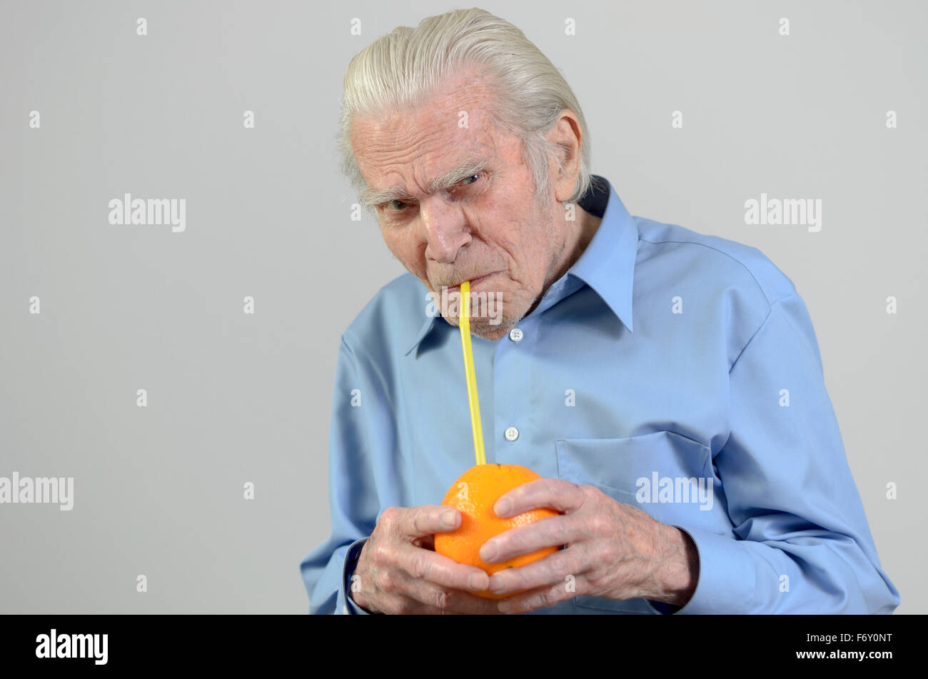 Man drinking juice through straw hi-res stock photography and images ...