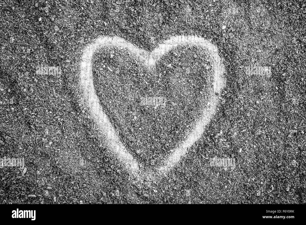 love heart shape made in the surface of saw dust Stock Photo - Alamy