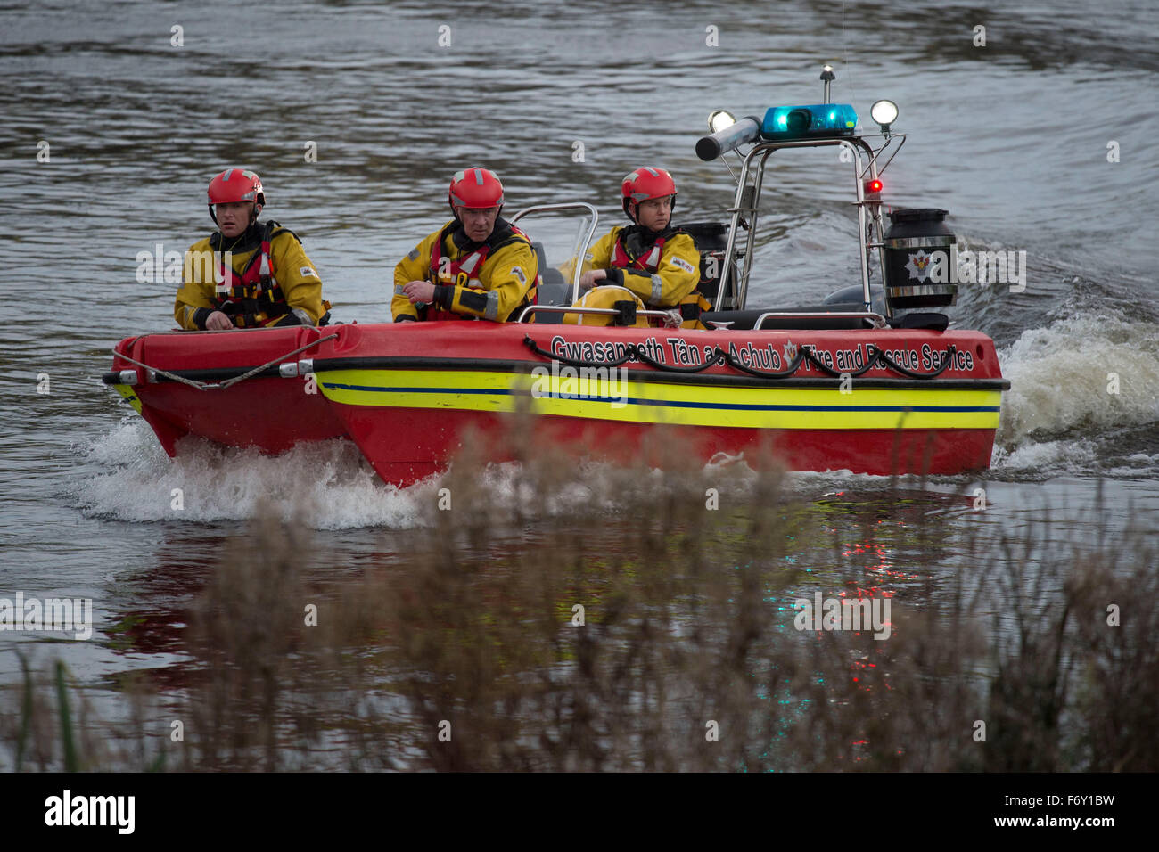 A South Wales Fire and Rescue team use a speed boat to search for a ...
