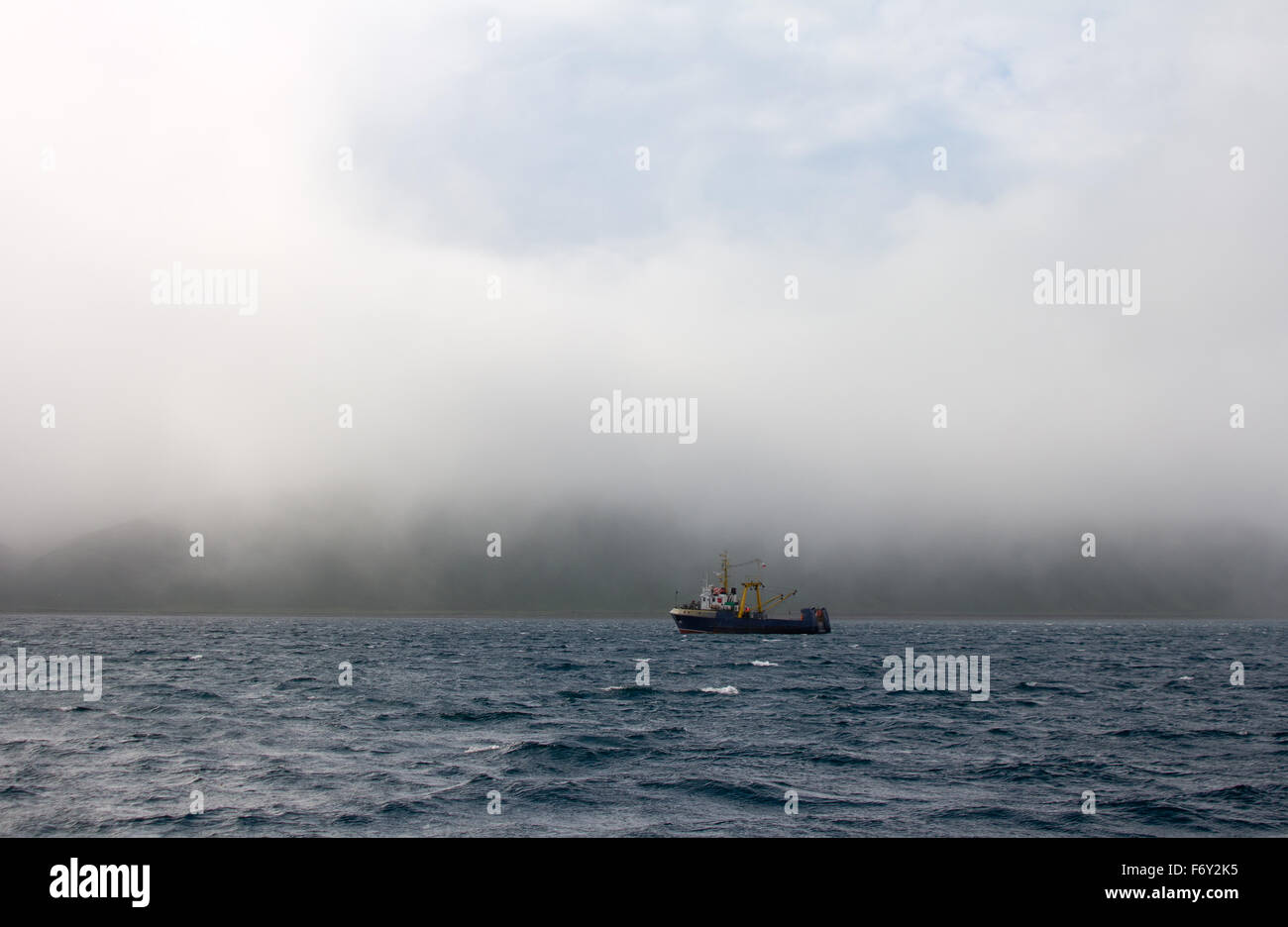 Fishing trawler during a storm in Pacific ocean near Commander Islands ...