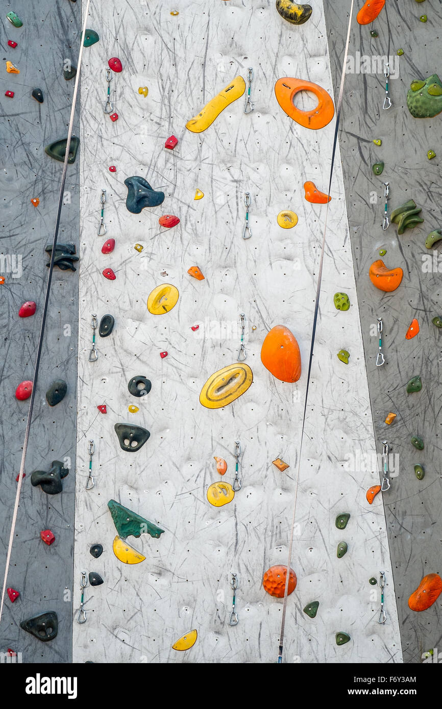 Detail of a climbing wall with variety of colorful handholds Stock ...