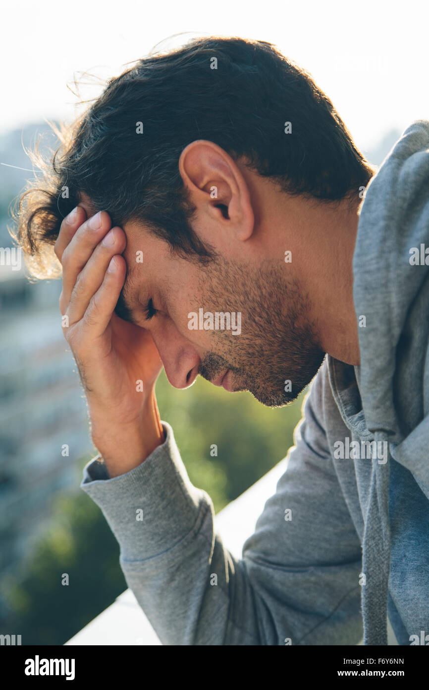 Worried young man Stock Photo - Alamy