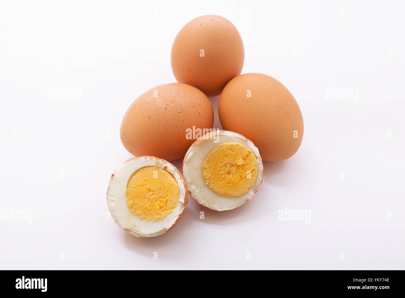 Shell boiled egg on white background Stock Photo - Alamy