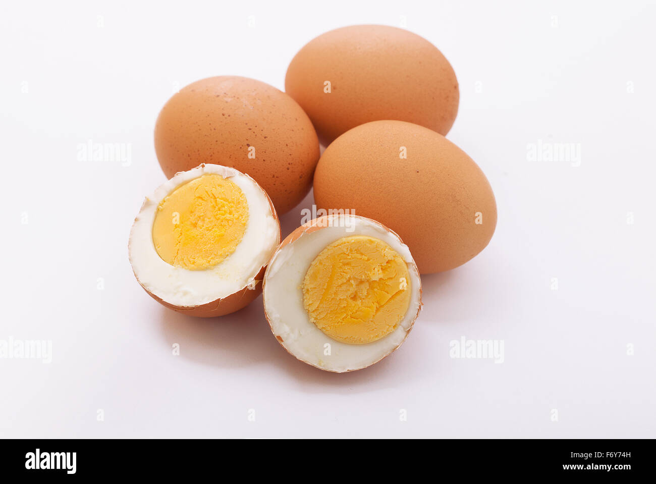 Shell boiled egg on white background Stock Photo - Alamy
