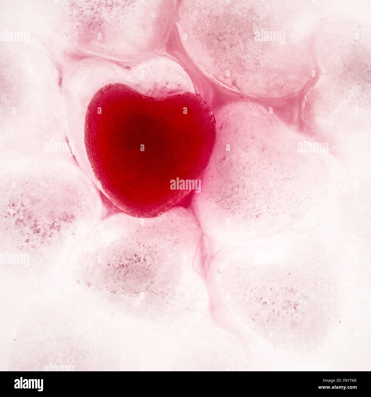 Ice cubes in the shape of a love heart melting into water Stock Photo ...
