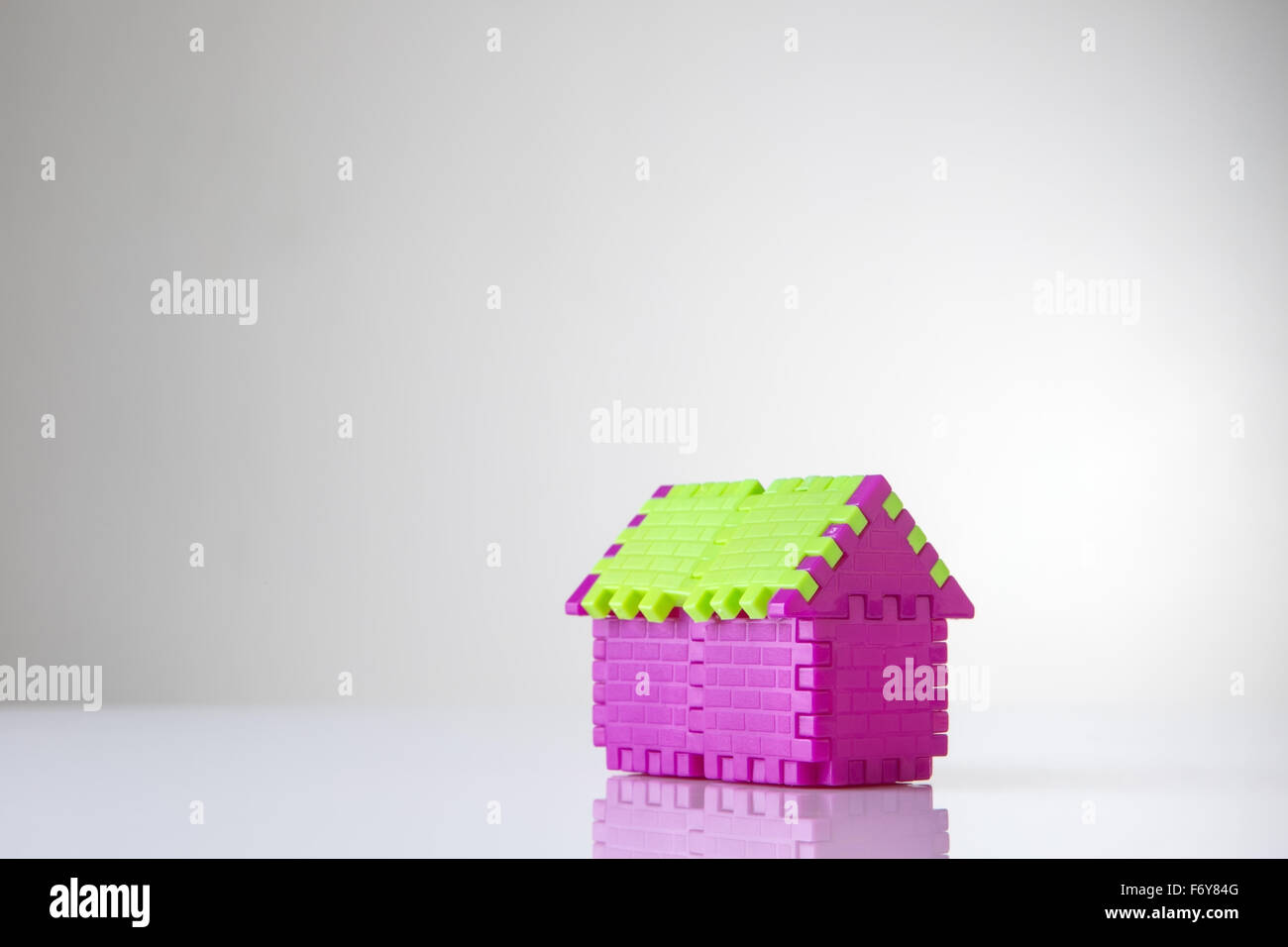 kids building blocks made into a shape of a house Stock Photo - Alamy