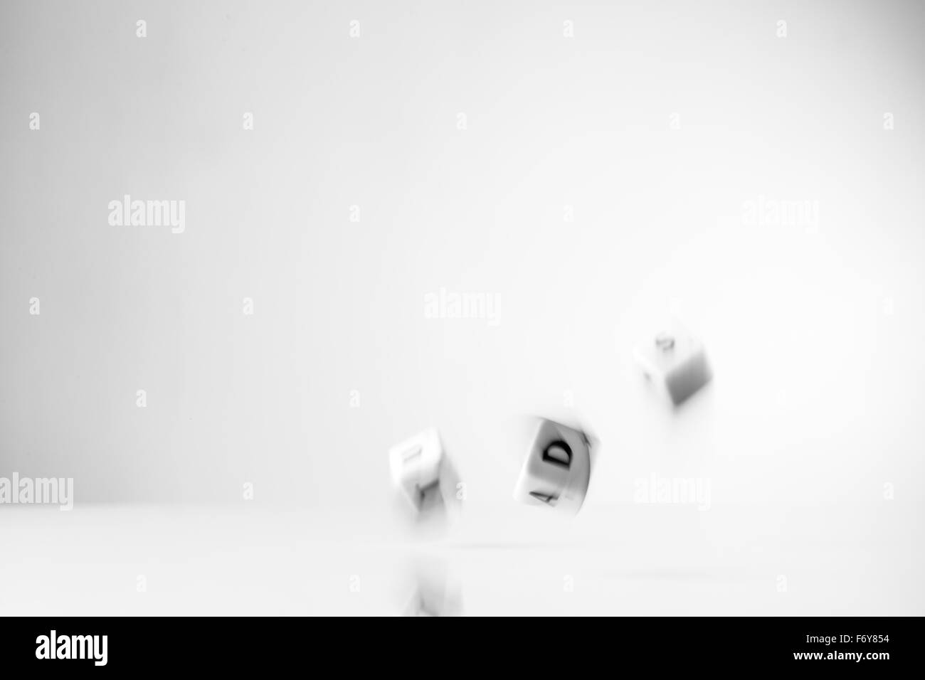 still life image of letter dice falling from the sky Stock Photo - Alamy