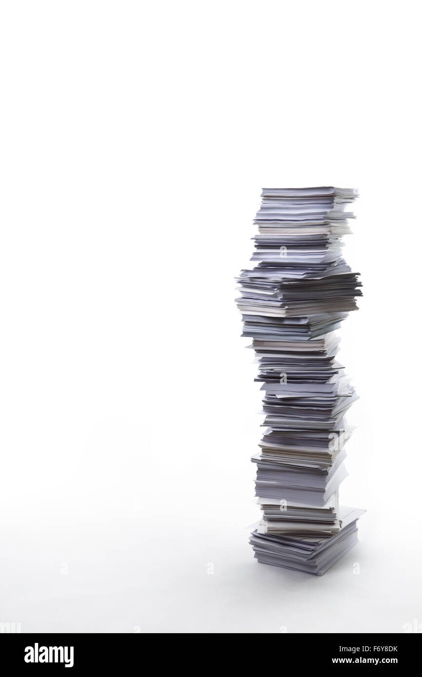 Very large stack of paper shot on white background Stock Photo - Alamy