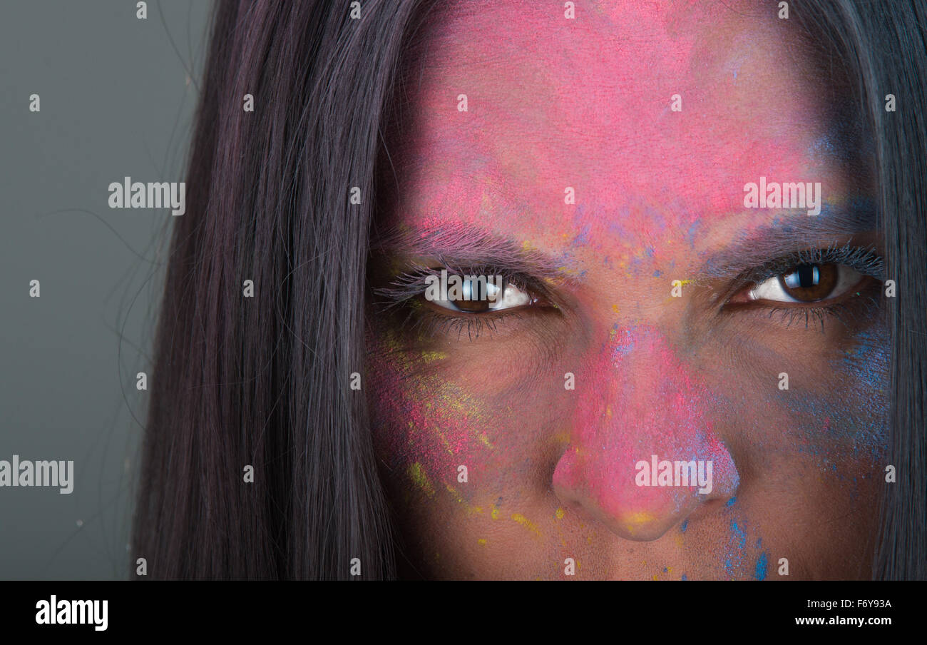 Beautiful young brunette girl with colorful decorated face Stock Photo ...