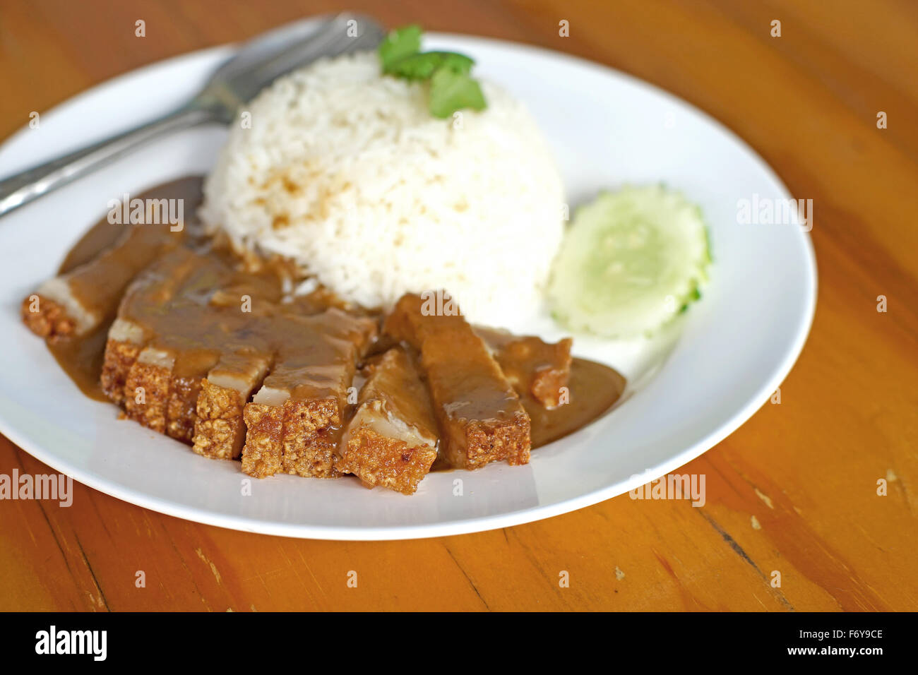 crispy pork in sauce with rice, crispy roasted belly pork Stock Photo ...