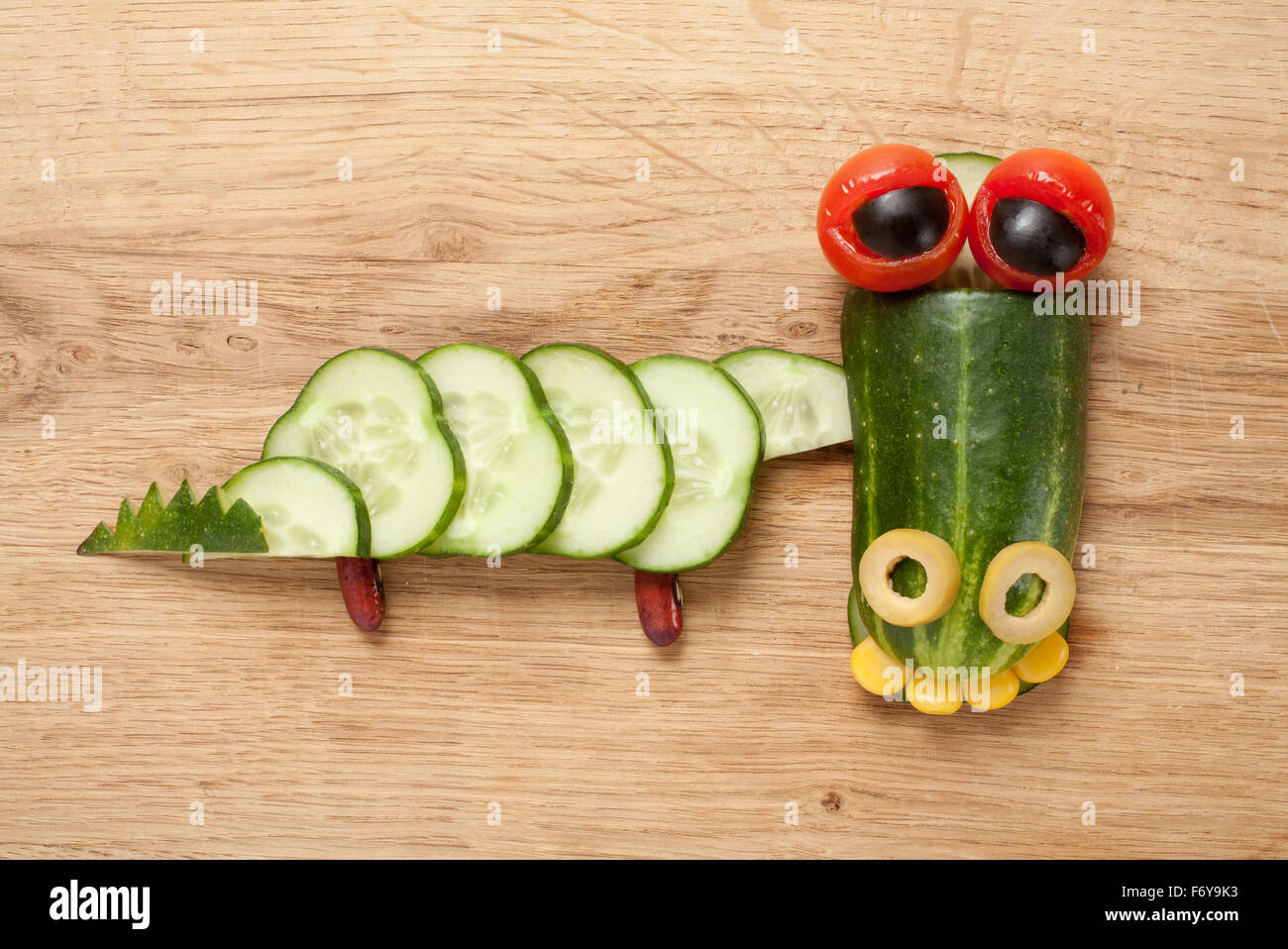 Crocodile made of vegetables on wooden background Stock Photo - Alamy