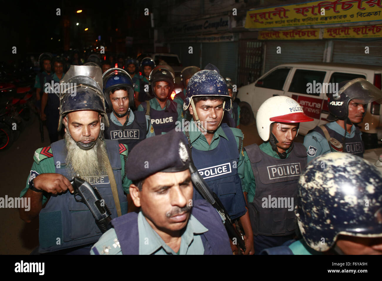 Dhaka, Bangladesh. 21st Nov, 2015. Bangladeshi security personnel stand ...
