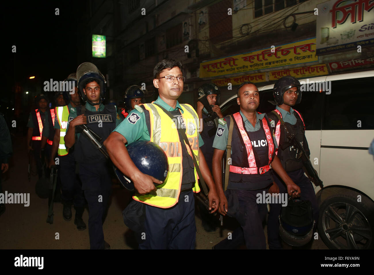 Dhaka, Bangladesh. 21st Nov, 2015. Bangladeshi security personnel stand ...