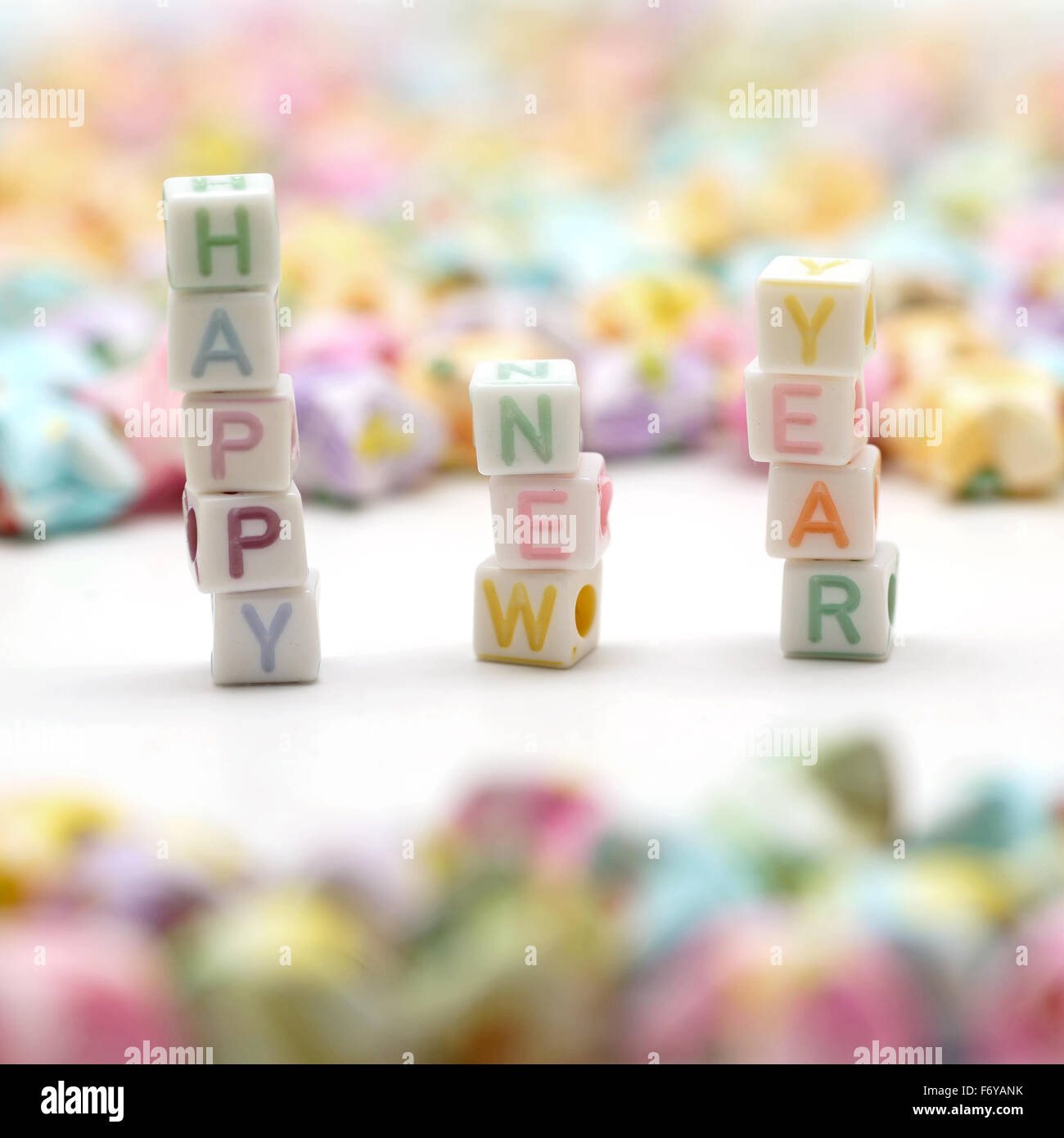 word happy new year with origami lucky stars isolated on white ...