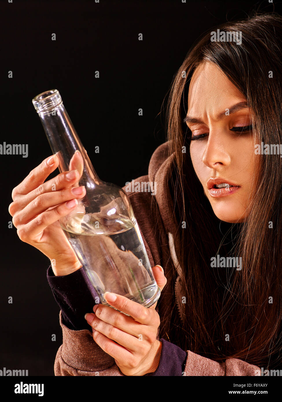 Drunk girl holding bottle of vodka Stock Photo - Alamy
