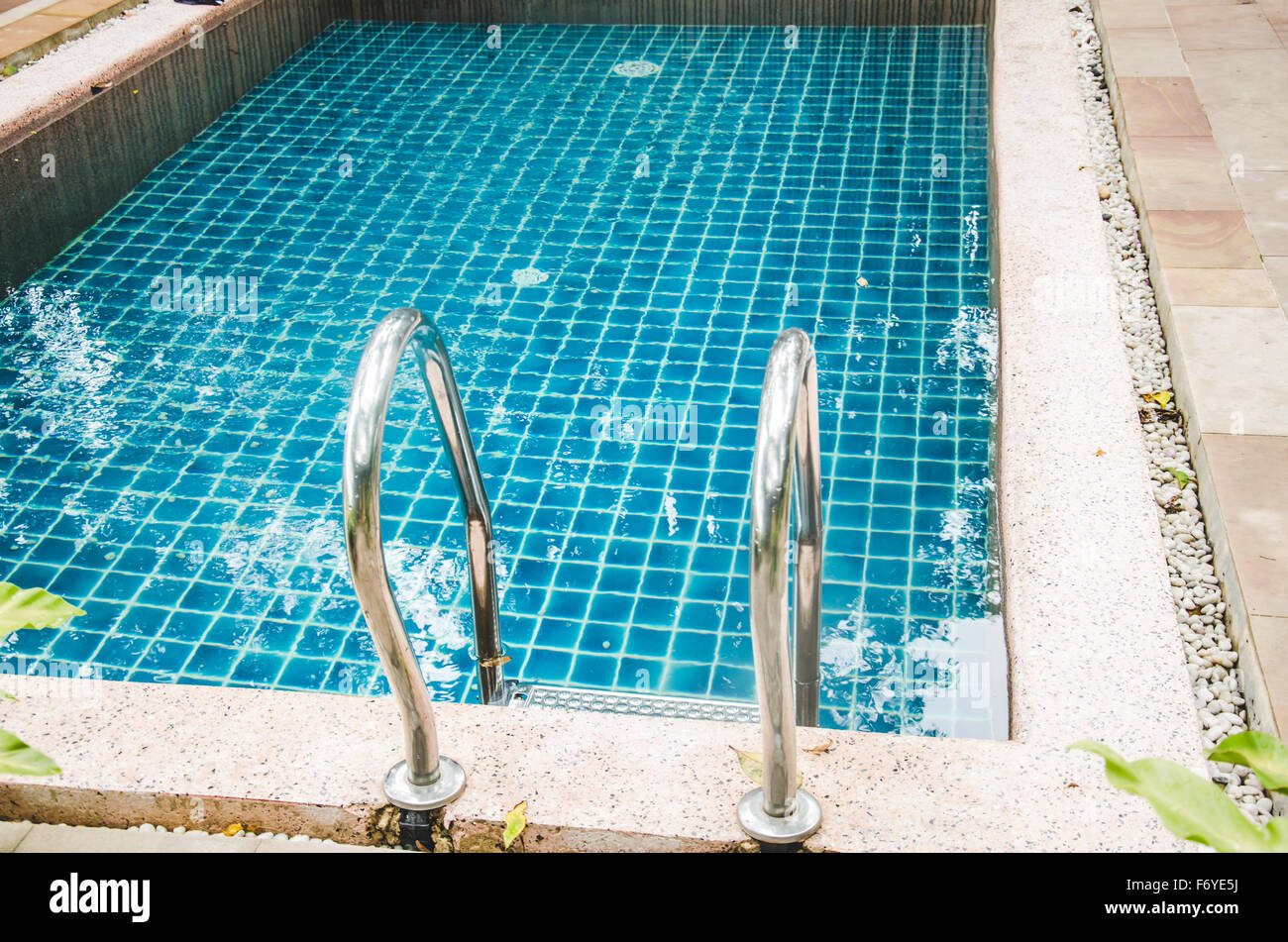 clear blue swimming pool close up in tropical Stock Photo - Alamy
