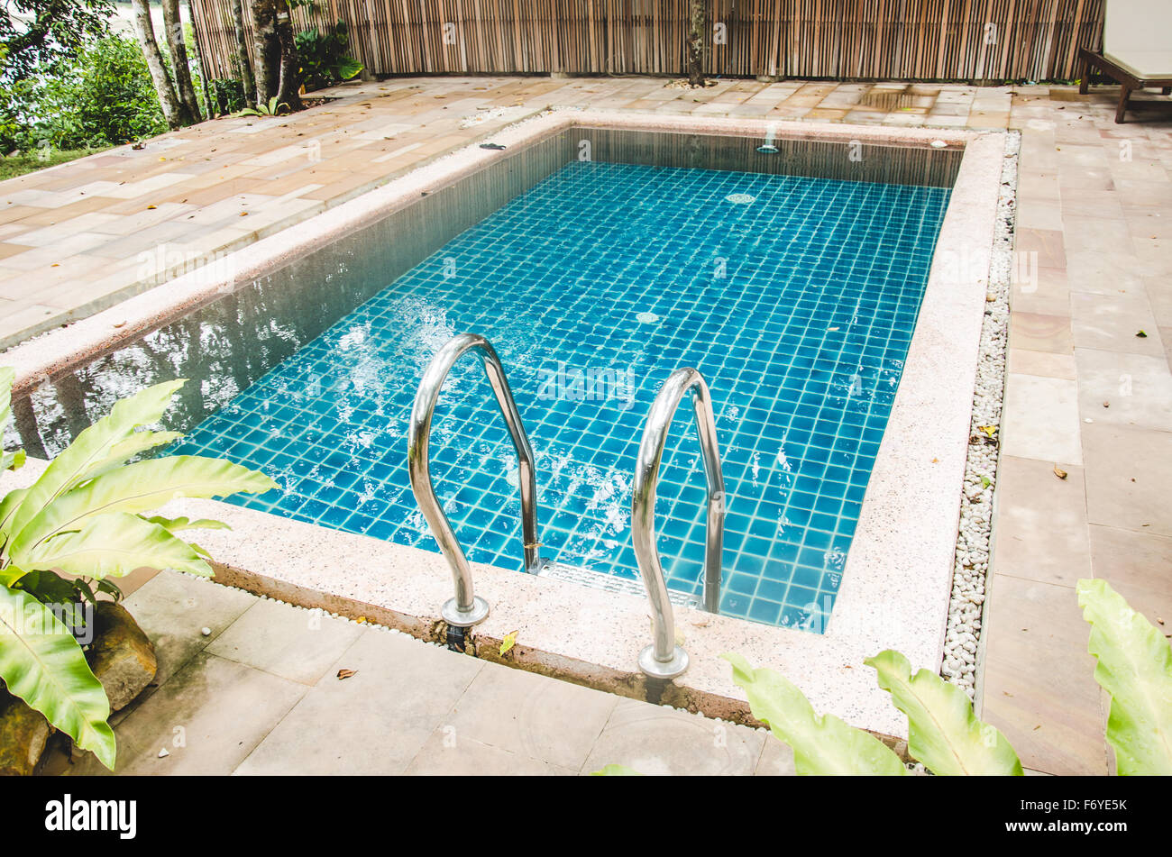 clear blue swimming pool close up in tropical Stock Photo - Alamy