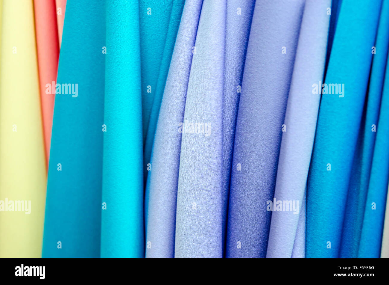 Closeup of various fabric bolts in store Stock Photo - Alamy