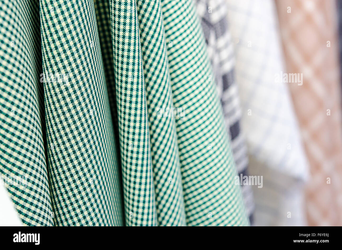 Closeup of various fabric bolts in store Stock Photo - Alamy