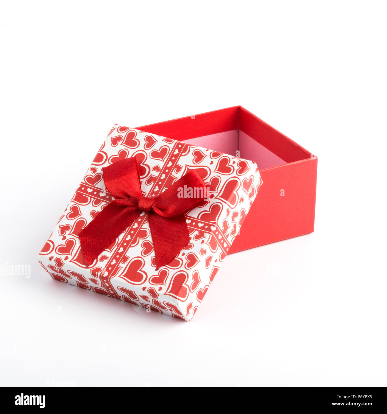 Red gift box now open on white background Stock Photo - Alamy