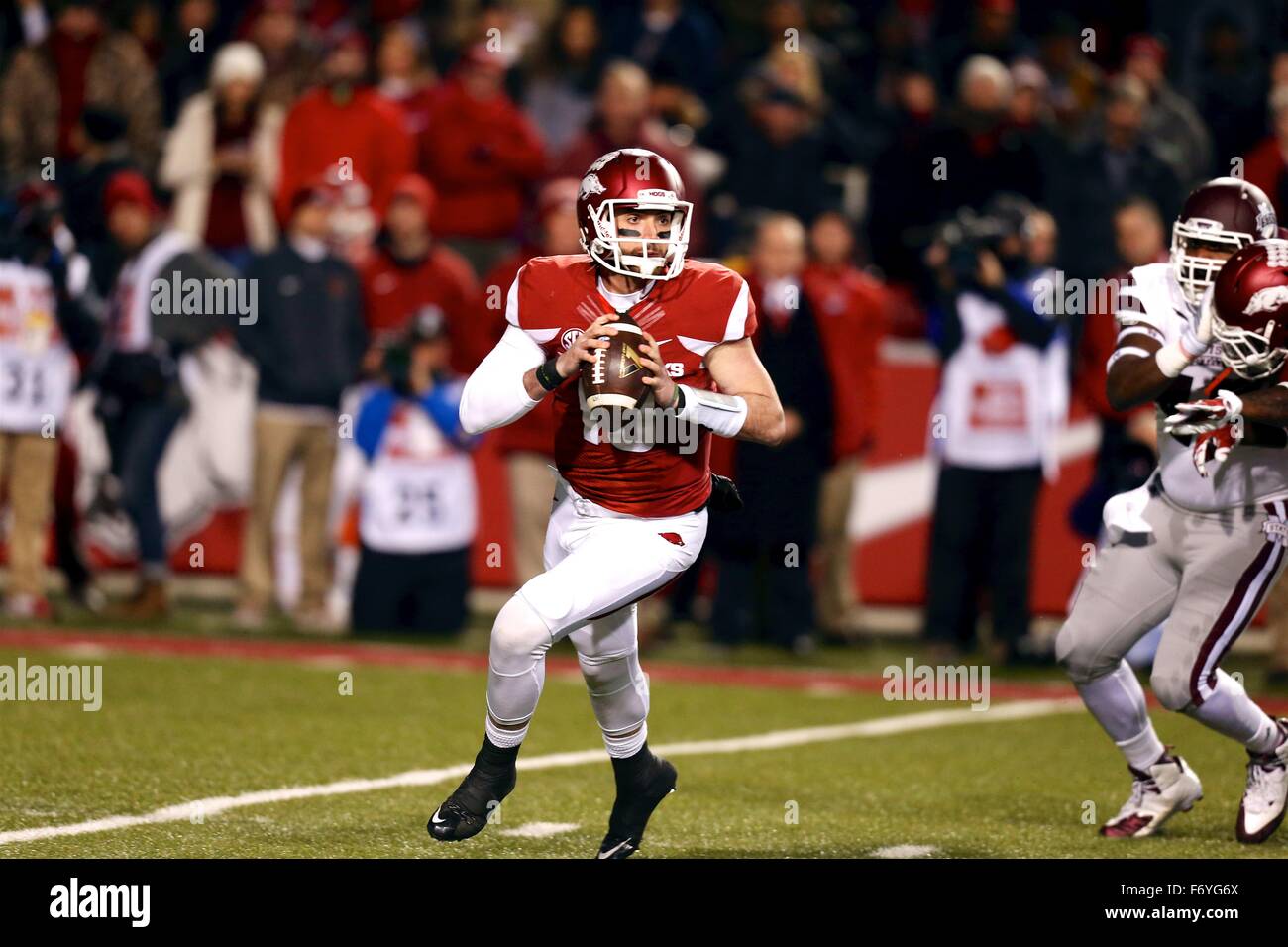 NOV 21, 2015: Arkansas QB Brandon Allen #10 rolls out of the pocket ...