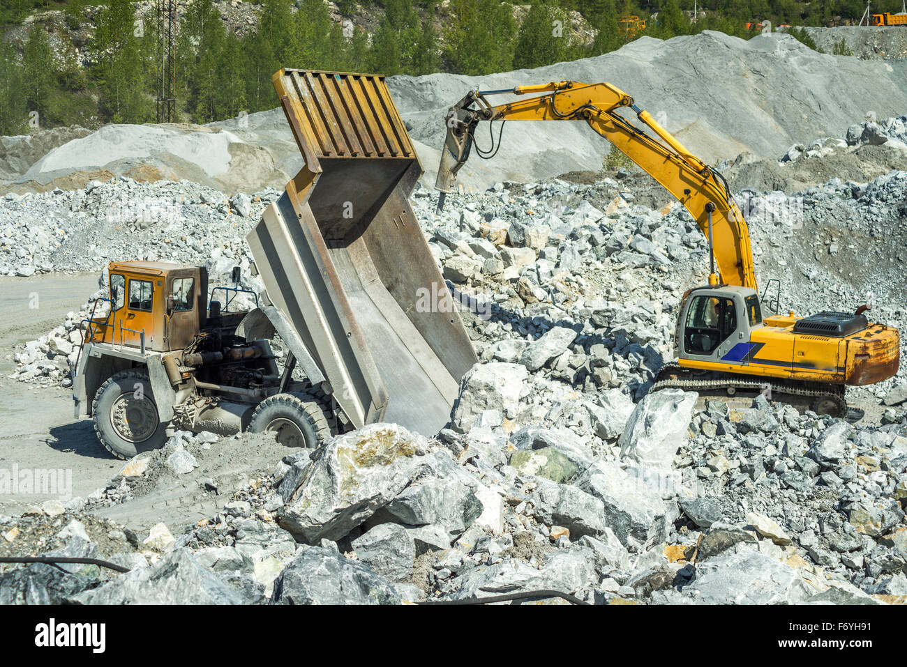 Industrial excavator loading soil material hi-res stock photography and ...
