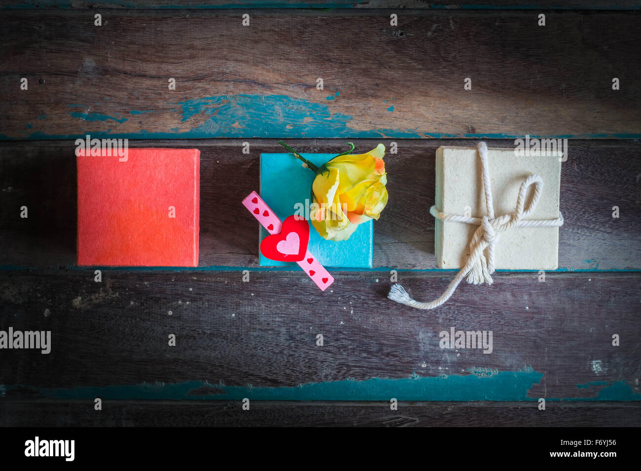The heart symbol and a gift box on background Stock Photo - Alamy