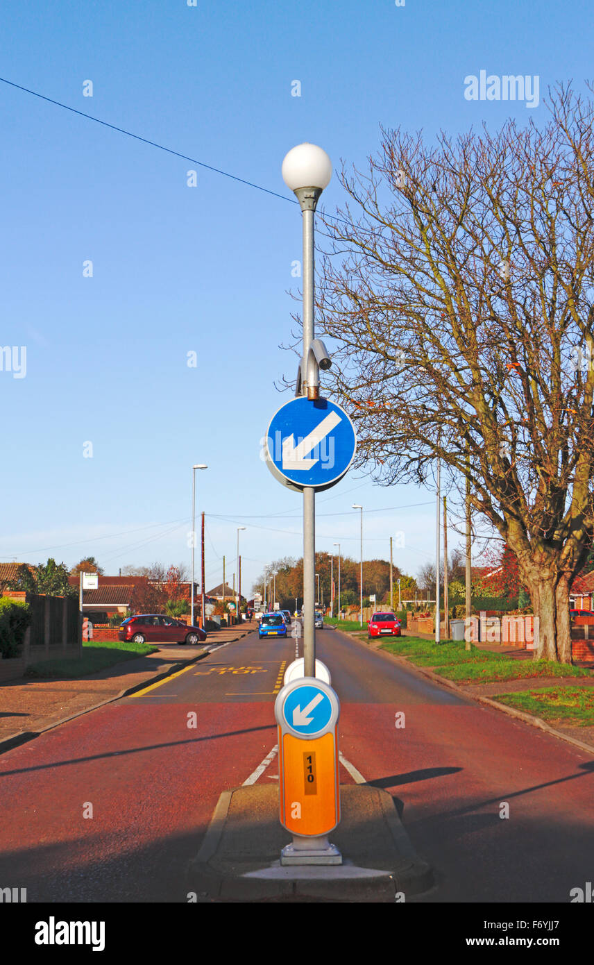 Keep left road signs in centre of road at Hellesdon, Norfolk, England ...