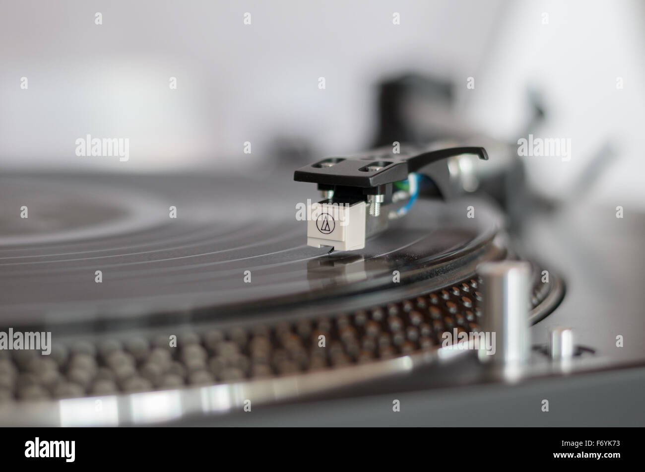 Closeup of a retro turntable while playing a vinyl record Stock Photo ...
