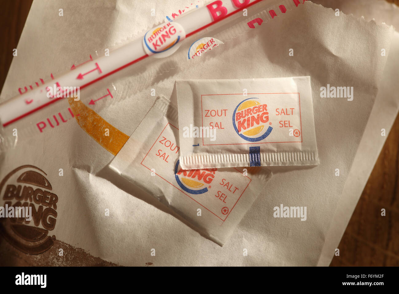 Burger King fries with salt sachets and straw Stock Photo - Alamy