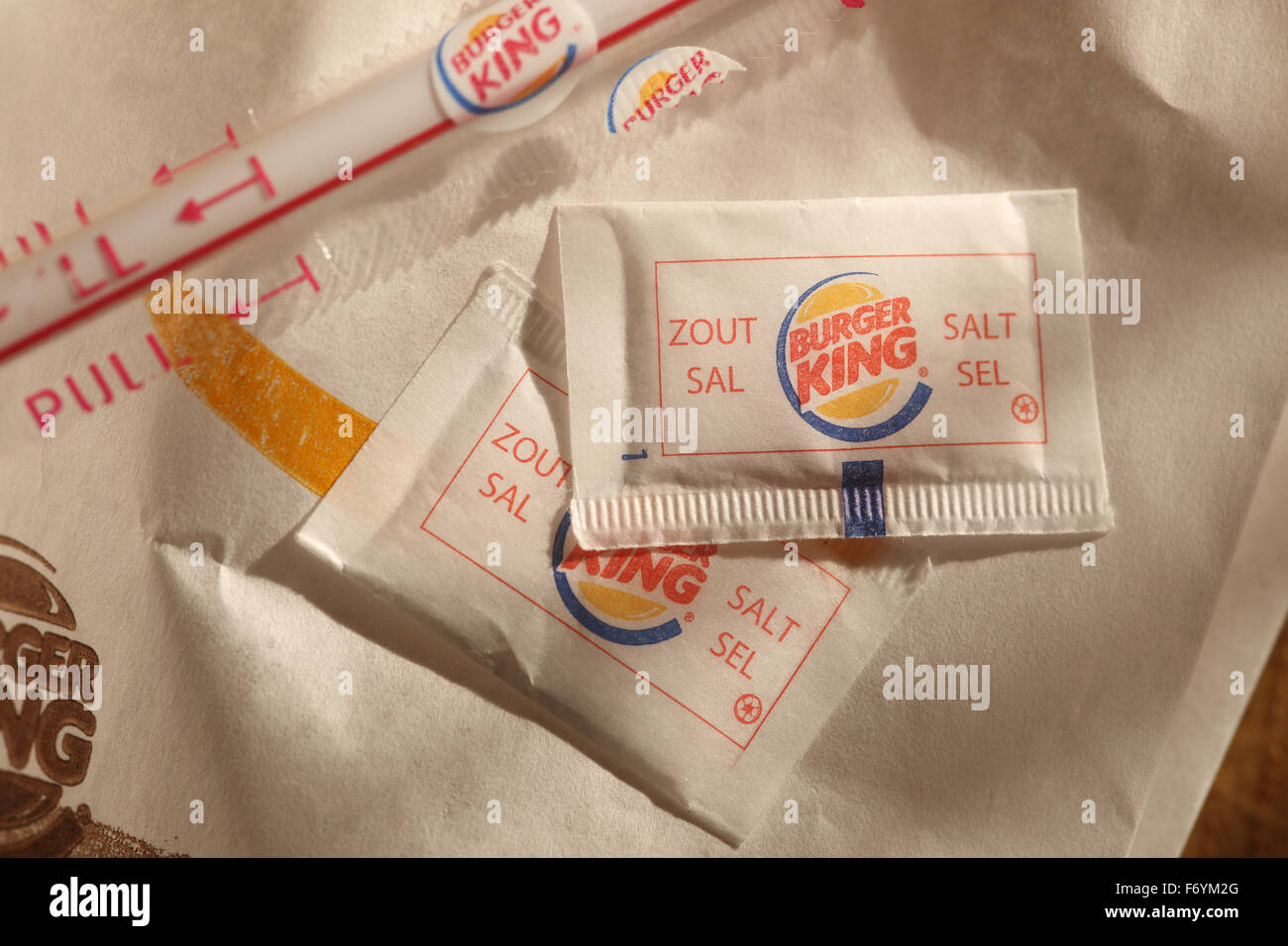 Burger King fries with salt sachets and straw Stock Photo - Alamy