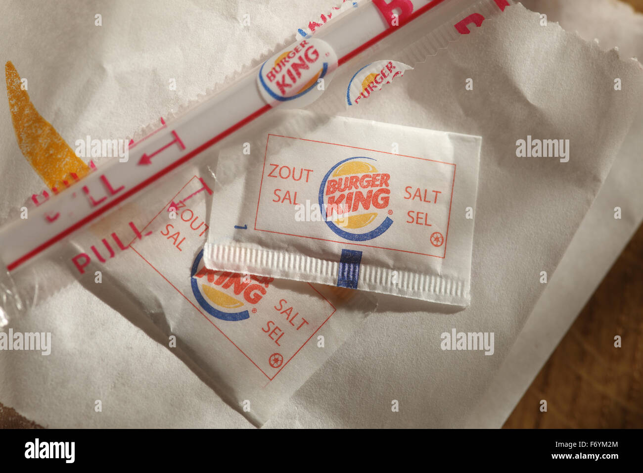 Burger King fries with salt sachets and straw Stock Photo - Alamy