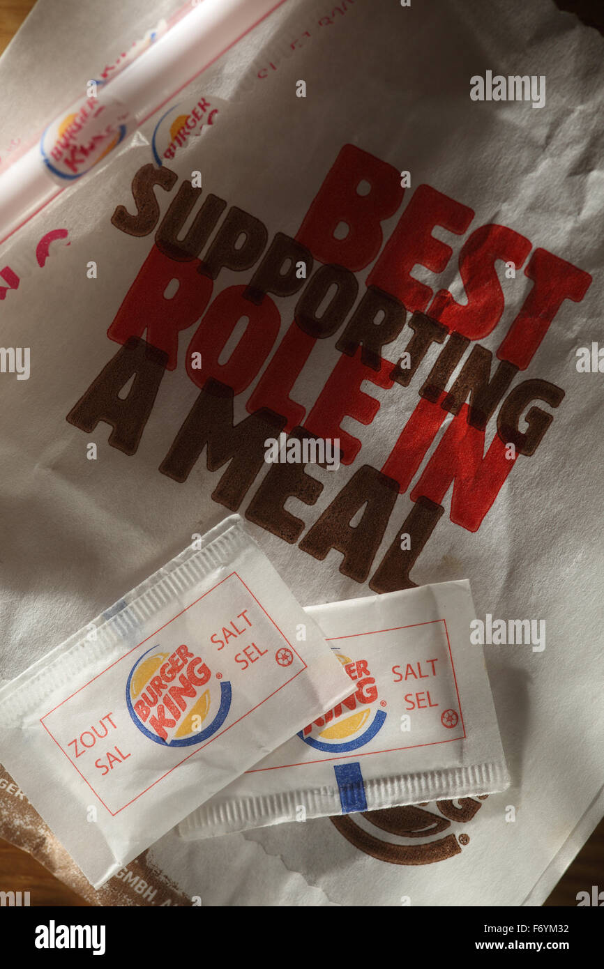 Burger King fries with salt sachets and straw Stock Photo - Alamy