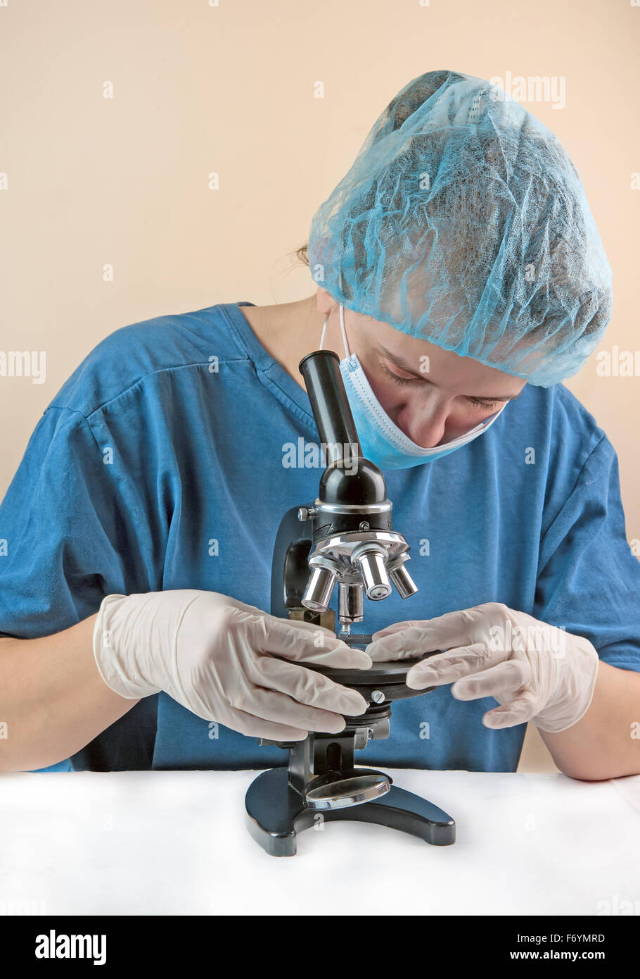 Close up of a scientist looking into a microscope in a laboratory Stock ...