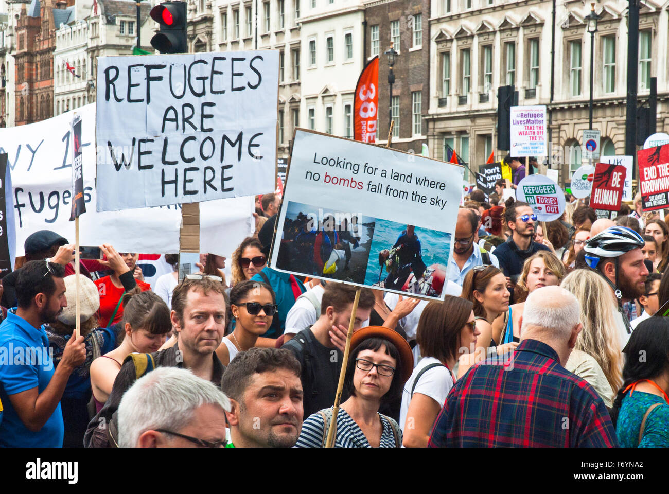 'Refugees welcome here' demonstration. Two posters "Refugees are ...