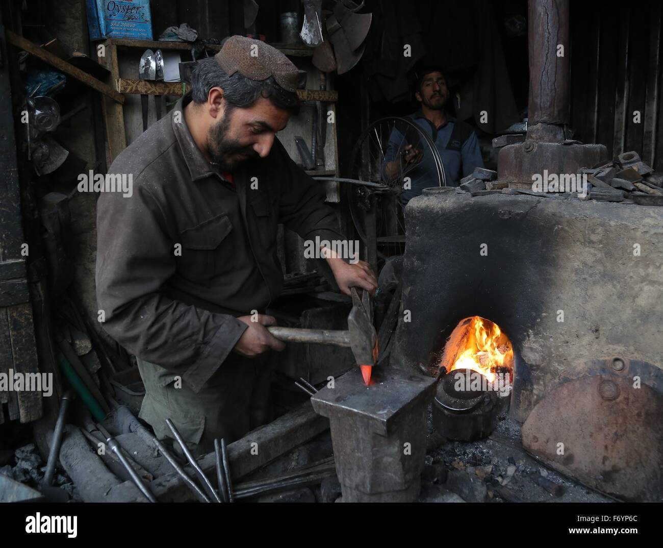 Kabul, Afghanistan. 22nd Nov, 2015. An Afghan blacksmith works at a ...
