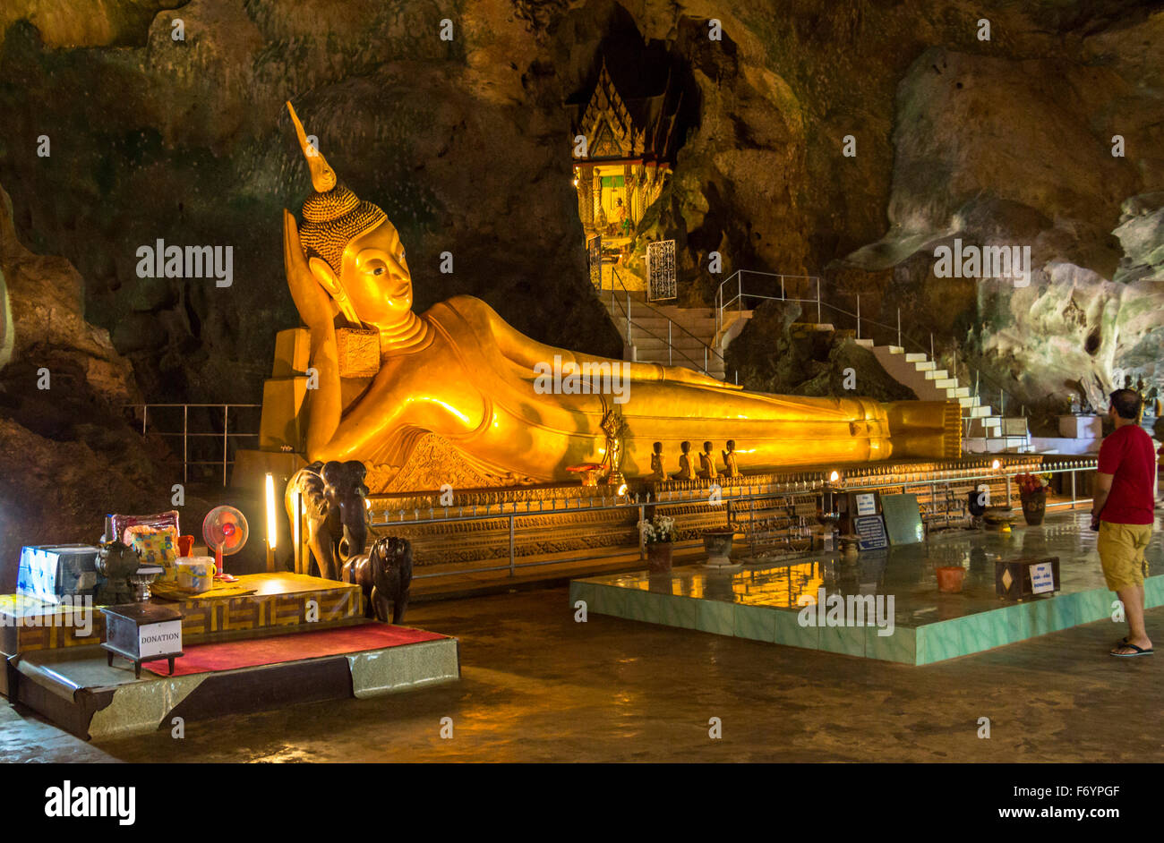 Lying buddha in cave Stock Photo - Alamy