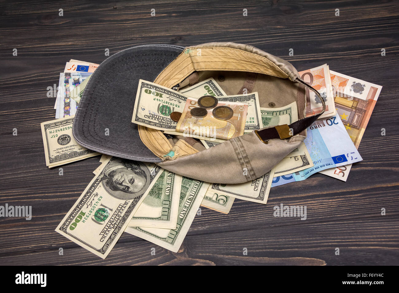 Money in the old cap. Financial concept background Stock Photo - Alamy