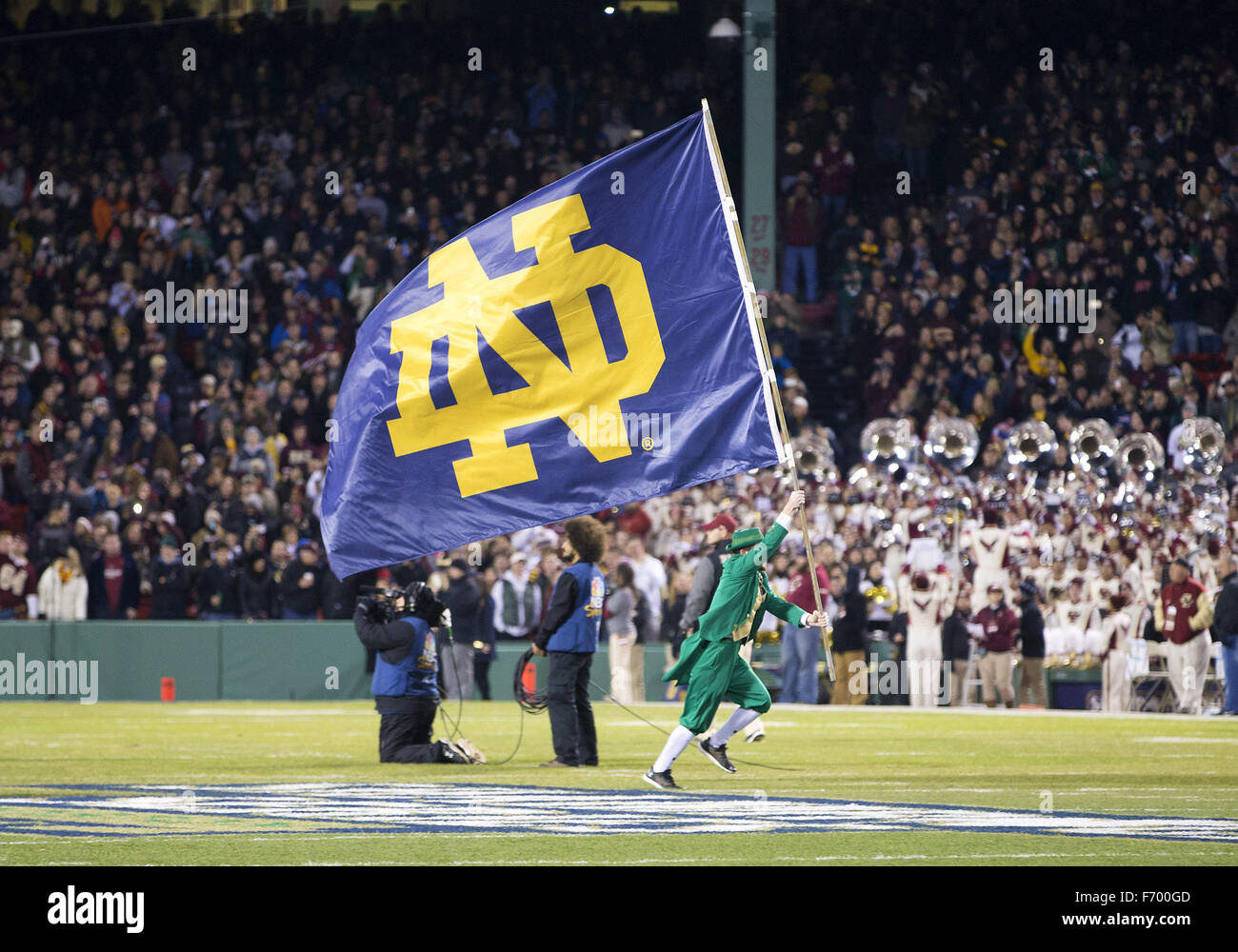 Boston, Massachusetts, USA. 21st Nov, 2015. Notre Dame Leprechaun leads ...