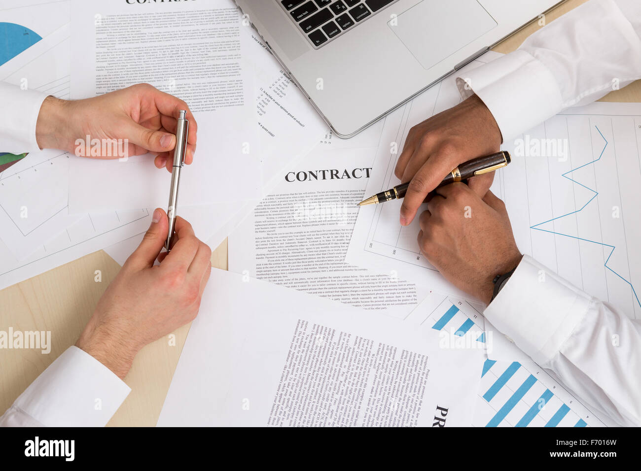 Close up partners signing contract hi-res stock photography and images ...