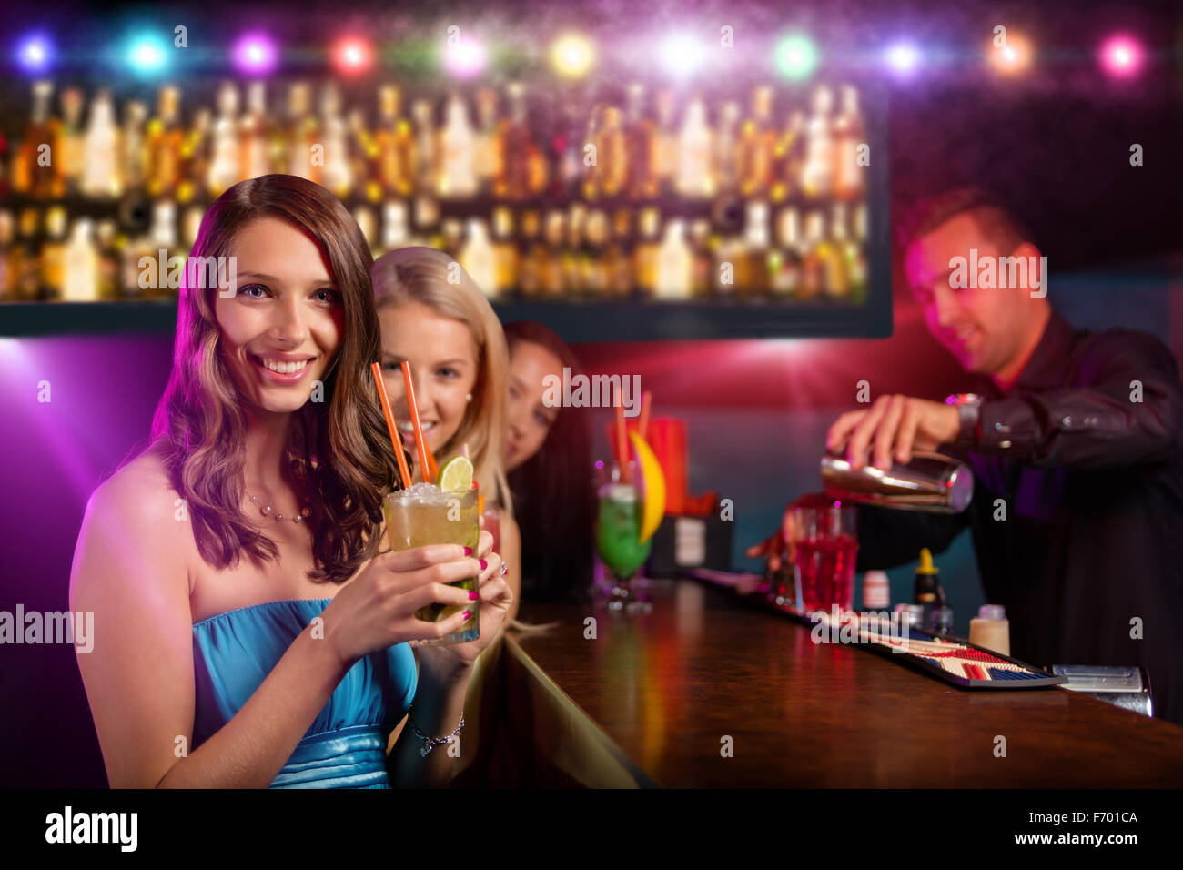 Young friends drinking cocktails together at party Stock Photo - Alamy