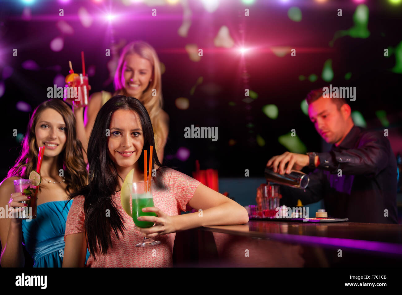 Young friends drinking cocktails together at party Stock Photo - Alamy