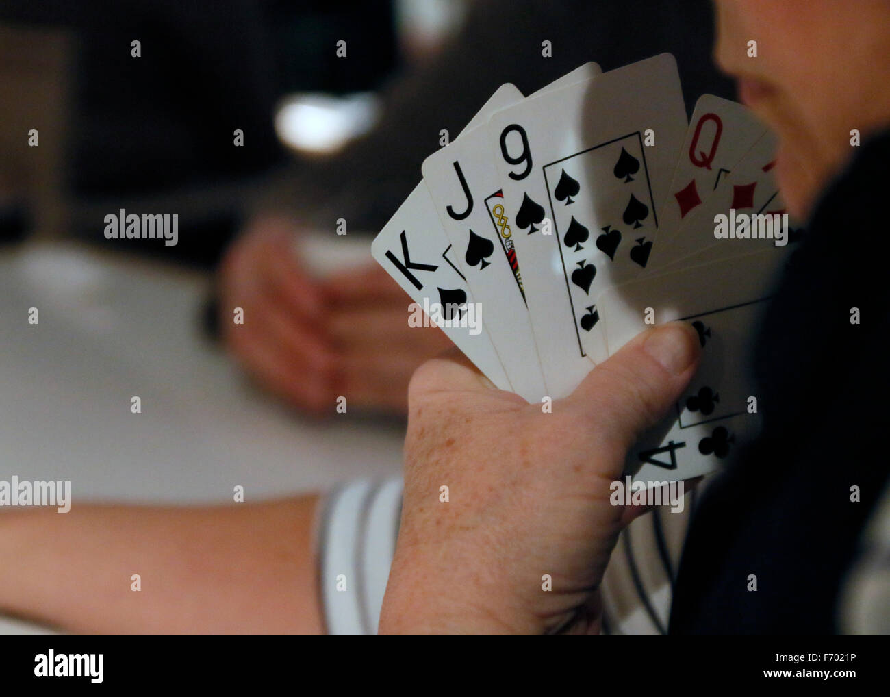 Playing cards in hand hi-res stock photography and images - Alamy