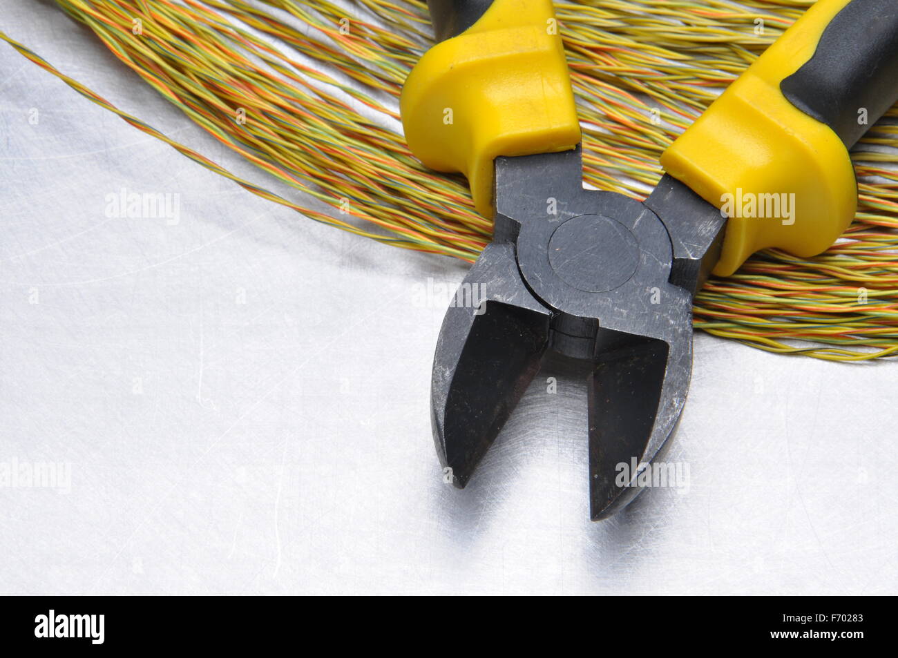 Electrical tools and cables on grey metal surface Stock Photo - Alamy