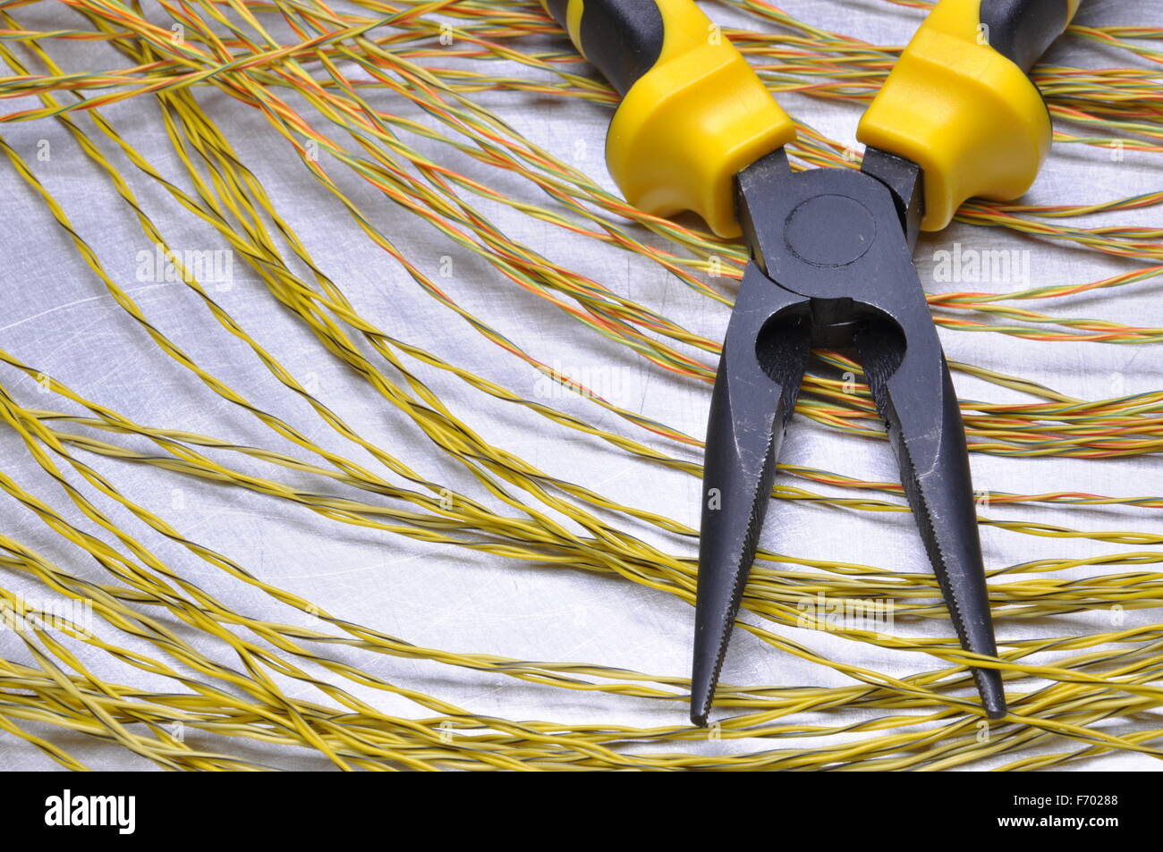 Electrical tools and cables on grey metal surface Stock Photo - Alamy