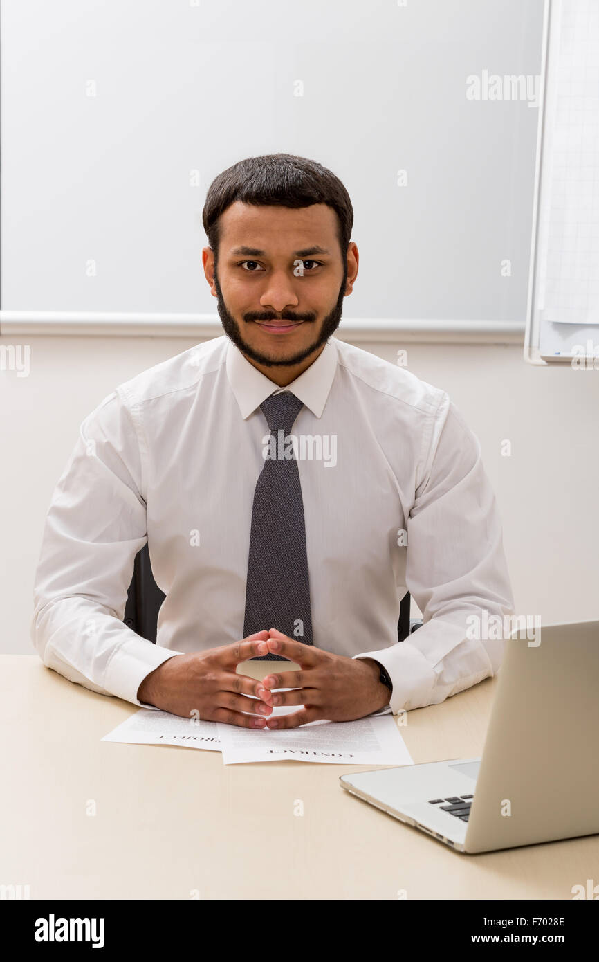 Black clerk in the office Stock Photo - Alamy